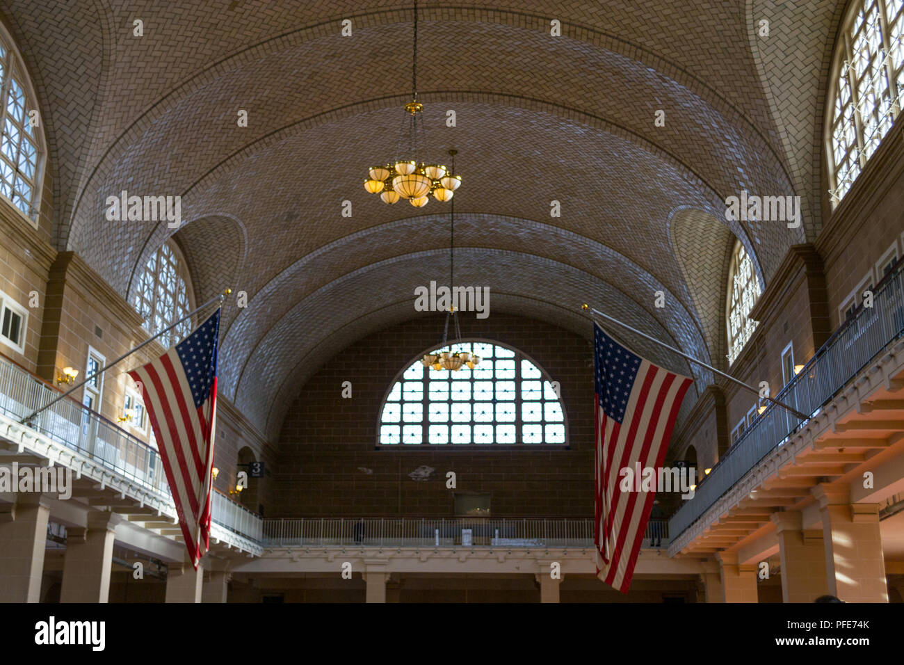 Registry room at Ellis island immigration center between 1900 and 1024 ...