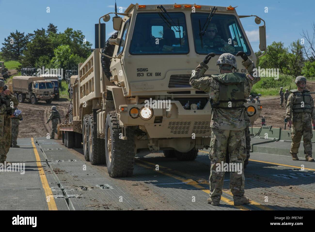 Soldiers assigned to the 200th Engineer Multiple Roll Bridge Company of ...