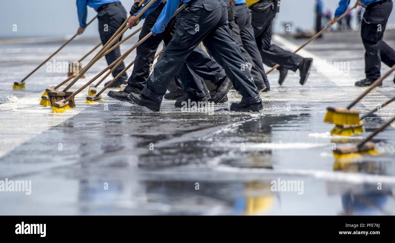 ATLANTIC OCEAN (June 9, 2018) Sailors scrub the flight deck aboard the ...