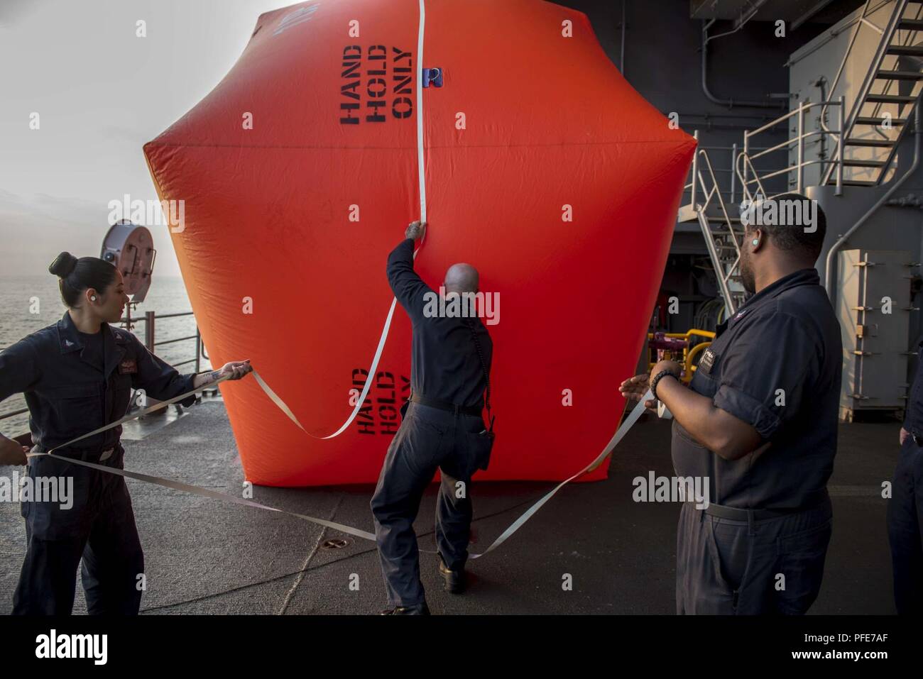 ATLANTIC OCEAN (June 9, 2018) Sailors tape the "Killer Tomato" floating ...