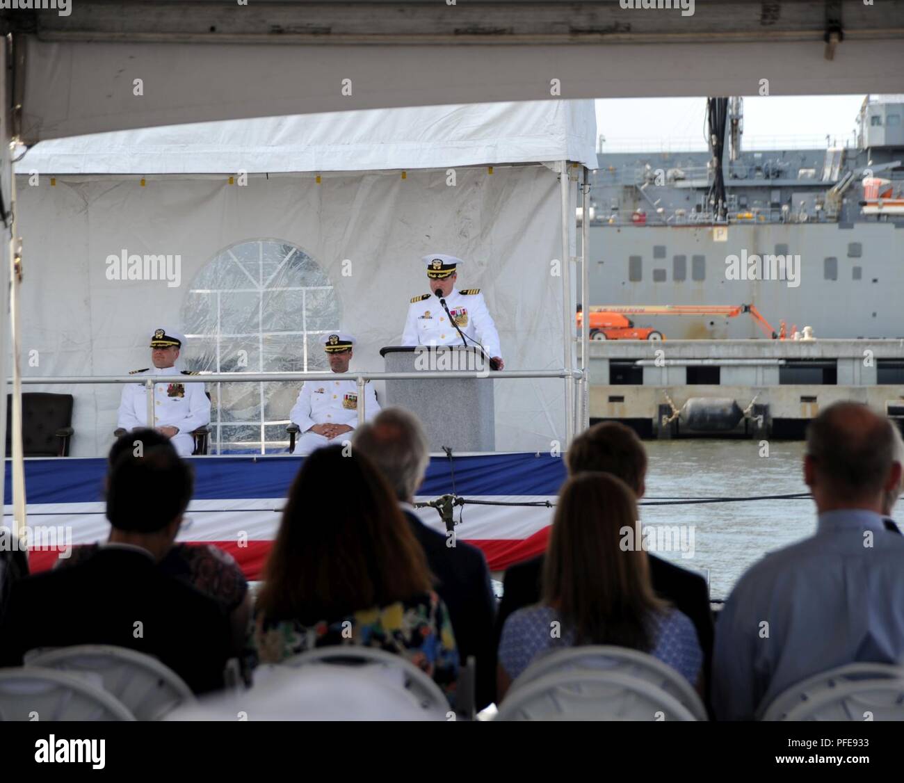 Capt. Carl Hartsfield, commander, Submarine Squadron Six, speaks of Cmdr. Christopher Osborn's ...