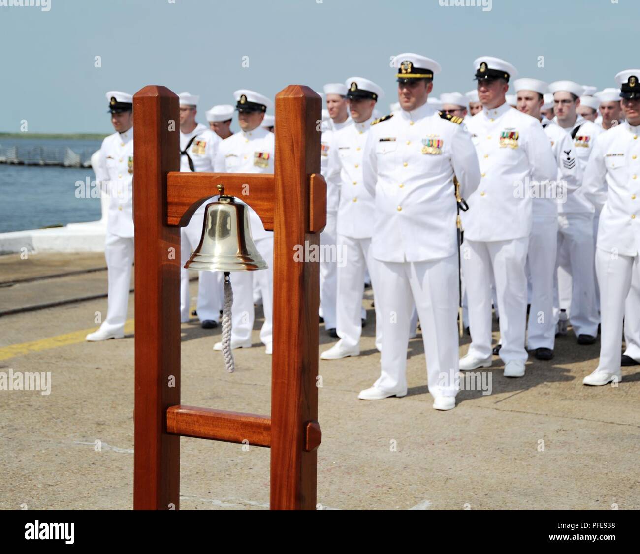 The crew of USS Boise (SSN 764) stand in formation during the change of ...