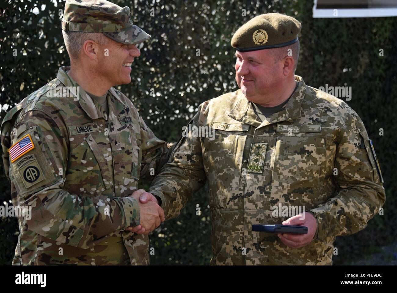 U.S. Army Brig. Gen. Christopher LaNeve, left, commanding general for ...