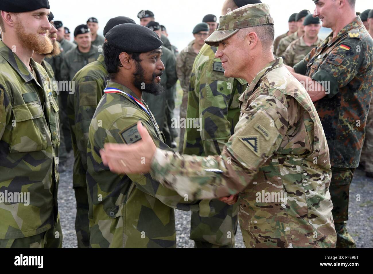 U.S. Army Brig. Gen. Christopher LaNeve, right, commanding general of ...