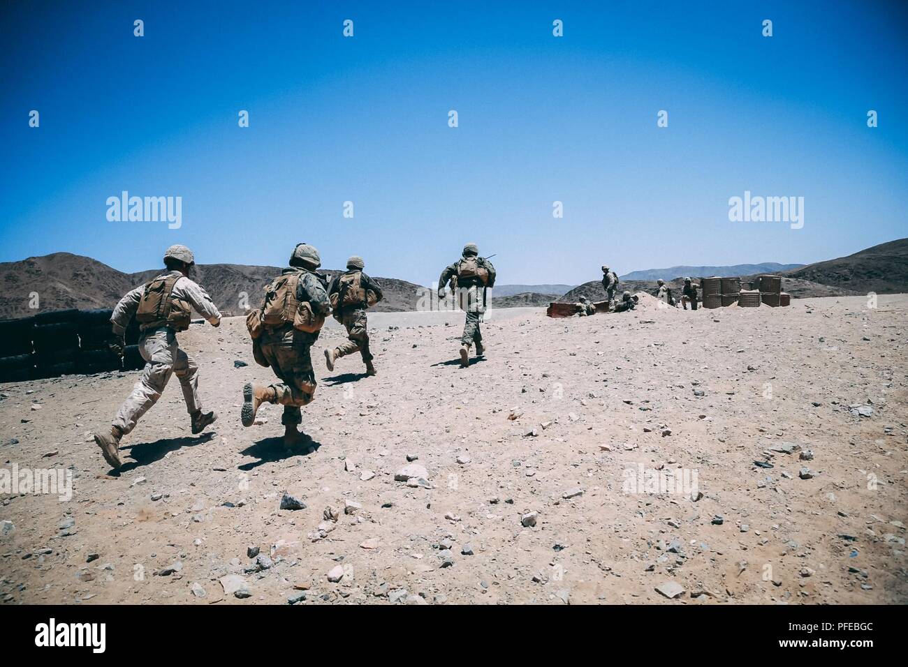 Marines in the Infantry Officer Course sprint to their next objective ...