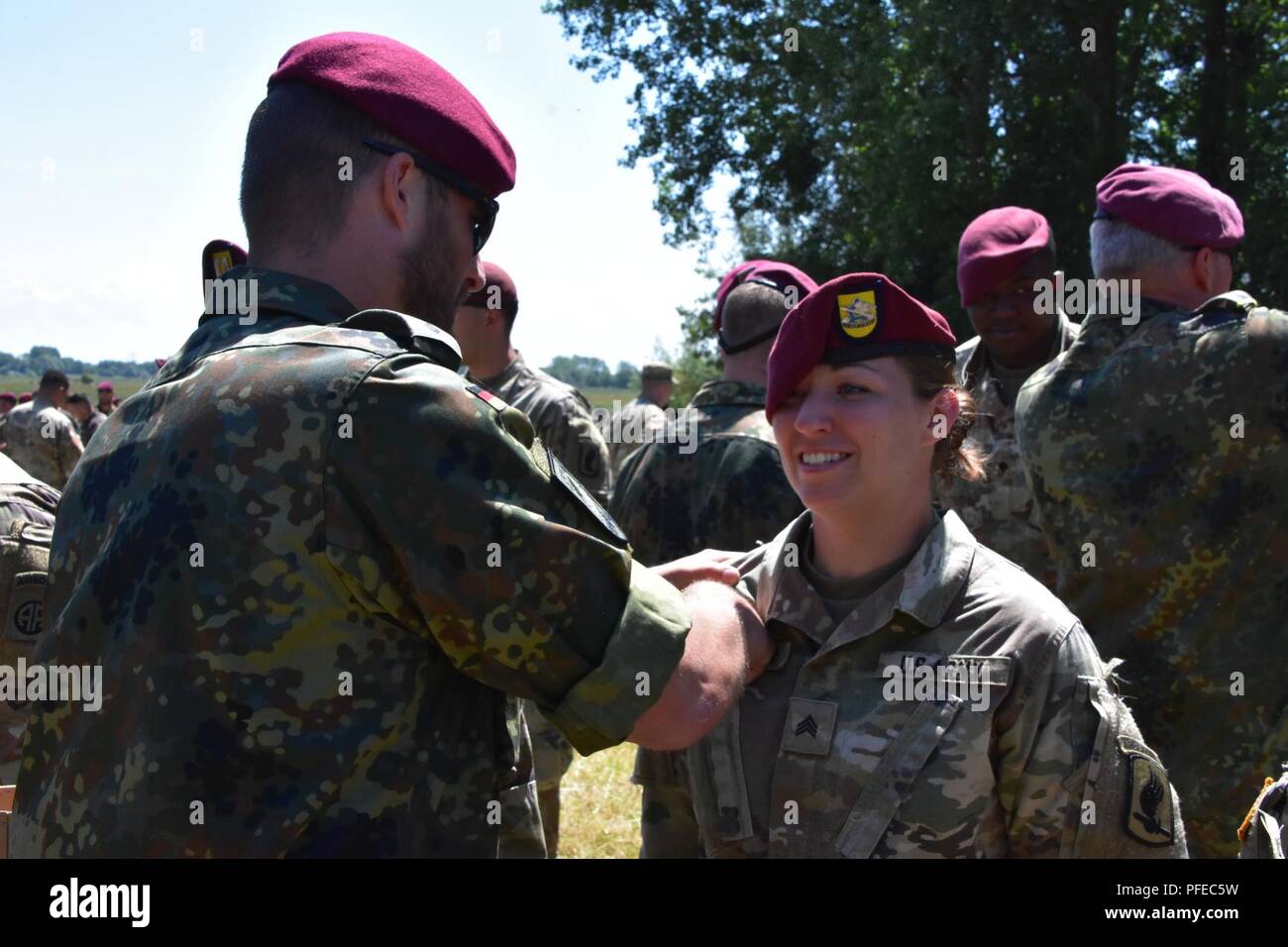 A German Jumpmaster pins the German Jump wings on 173rd Airborne ...