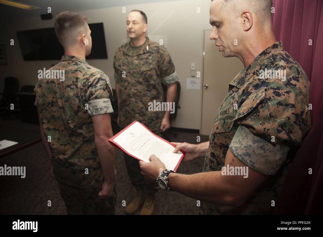 CAMP FOSTER, OKINAWA, Japan – Master Sgt. Daniel J. Melton reads a ...