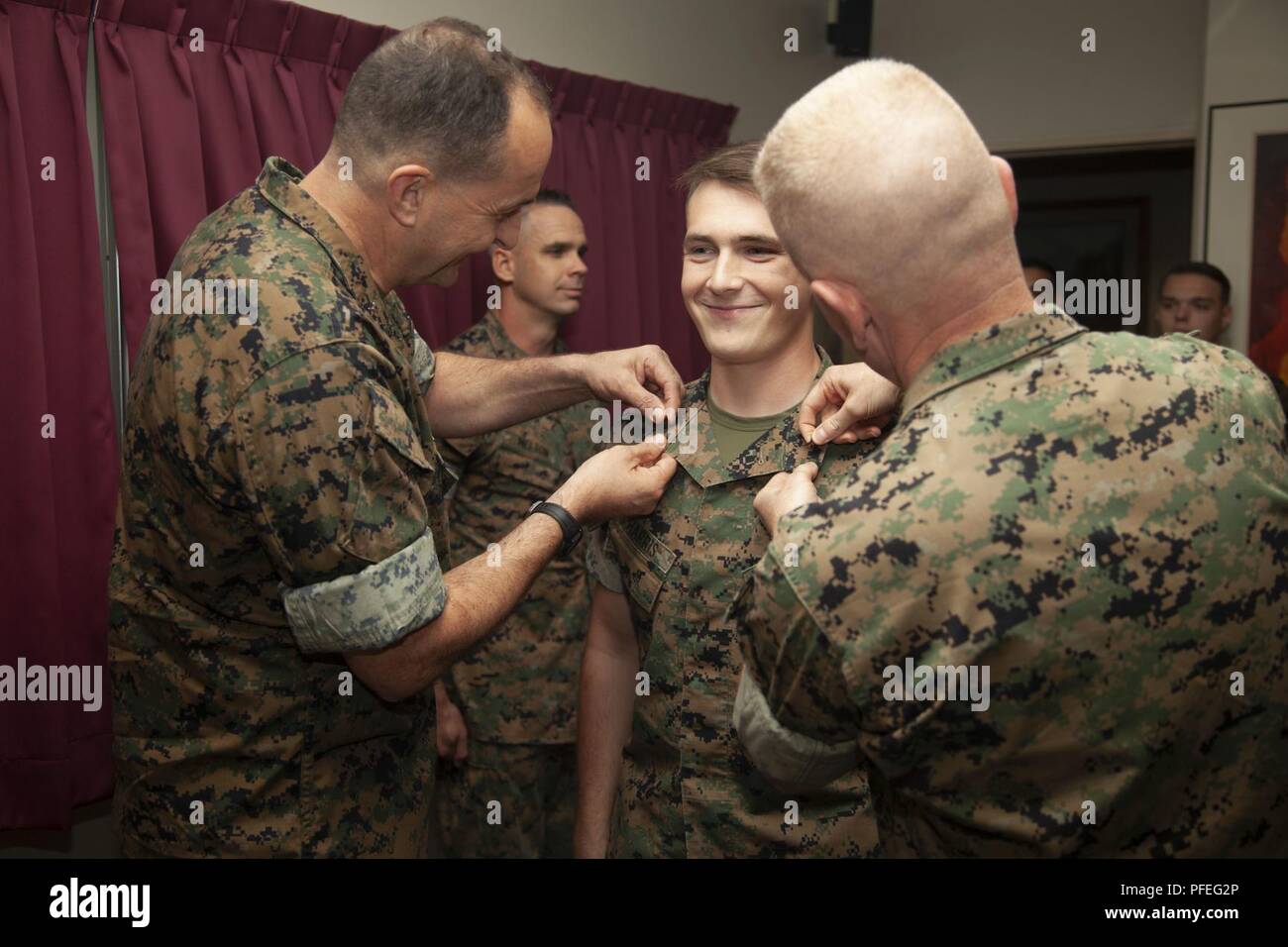 CAMP FOSTER, OKINAWA, Japan – Lance Cpl. Roy Harris Jr., middle, is ...