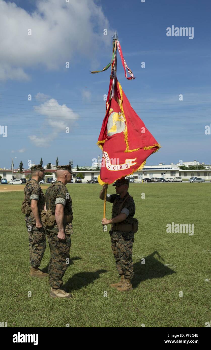 CAMP FOSTER, OKINAWA, Japan – Sgt. Maj. George Garcia delivers colors ...