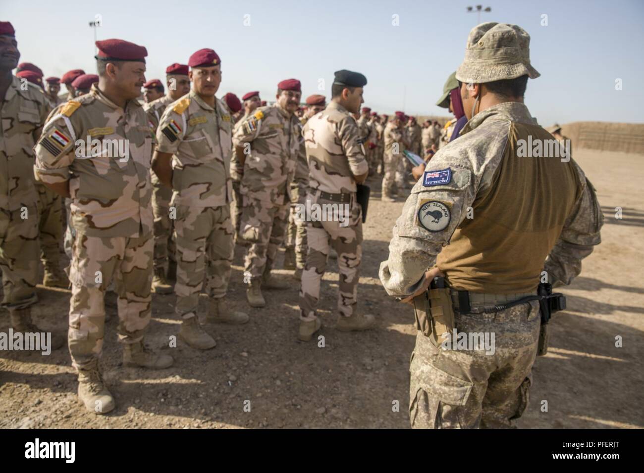 A New Zealand defense force member, with Task Group Taji, conducts roll ...