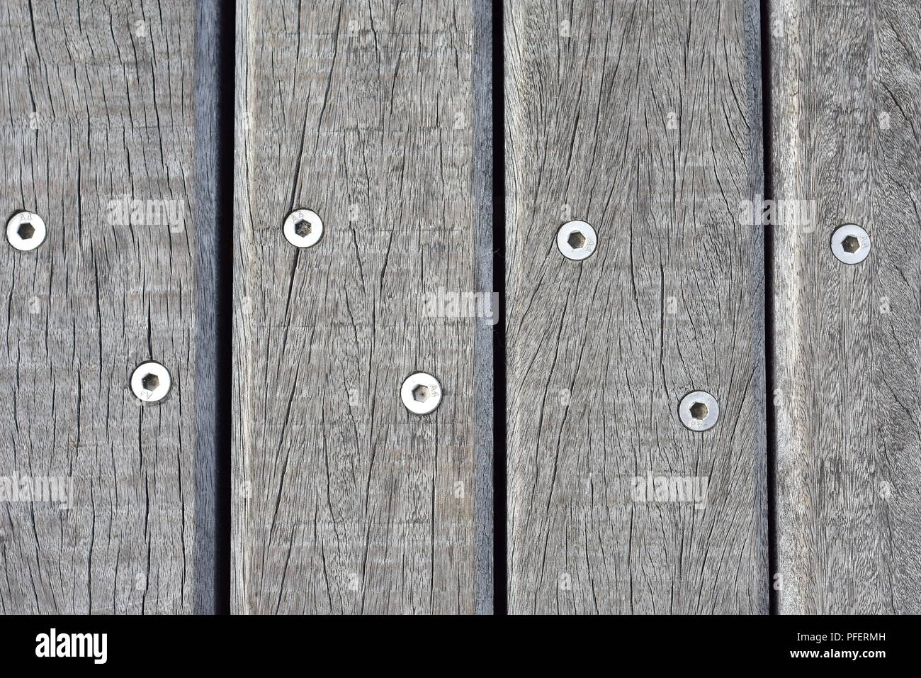 Stainless steel Allen bolts in two rows wooden slate floor Stock Photo ...