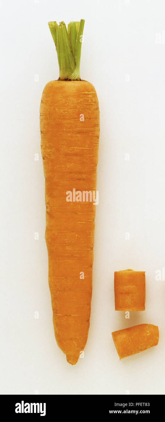 A whole Carrot and two pieces next to it Stock Photo - Alamy