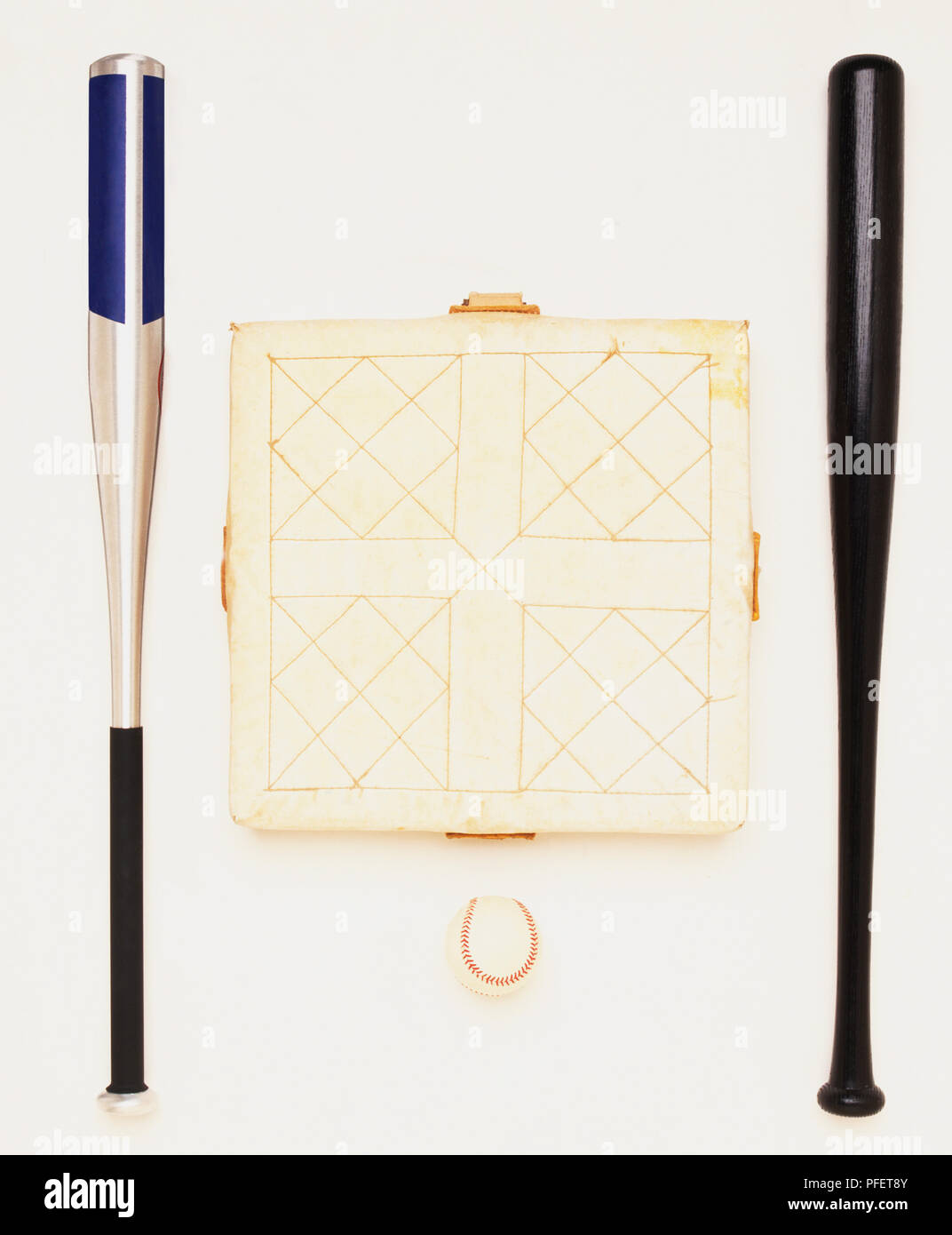 Two baseball bats, ball and base, front view Stock Photo - Alamy