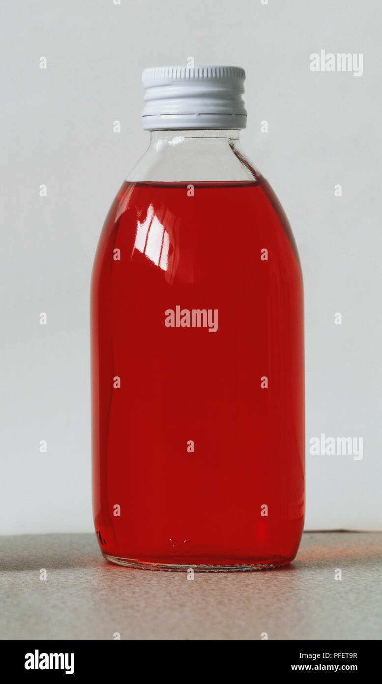 Assorted medicine bottles containing liquids, cream and pills, front ...