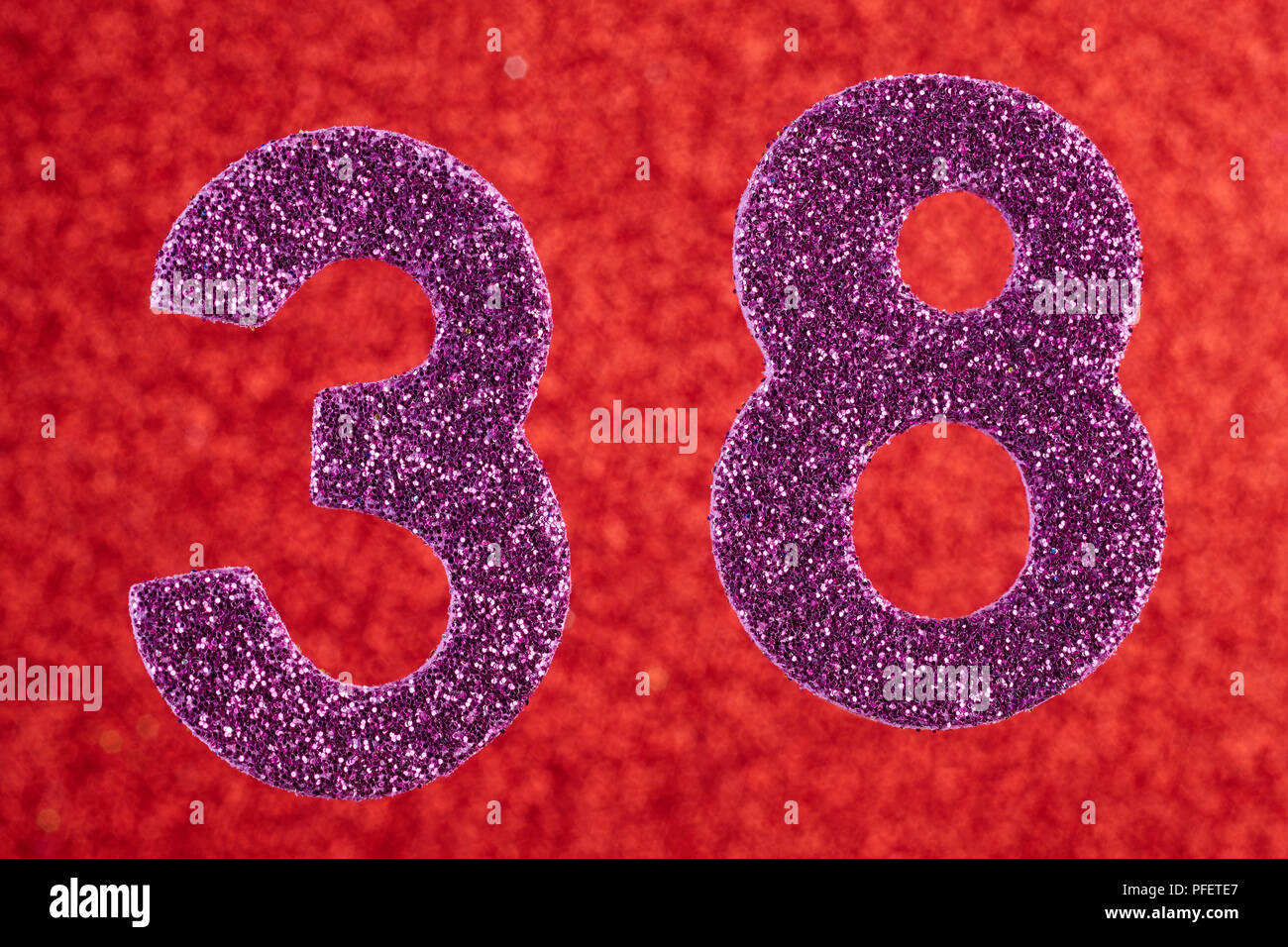Number thirty-eight purple color over a red background. Anniversary ...