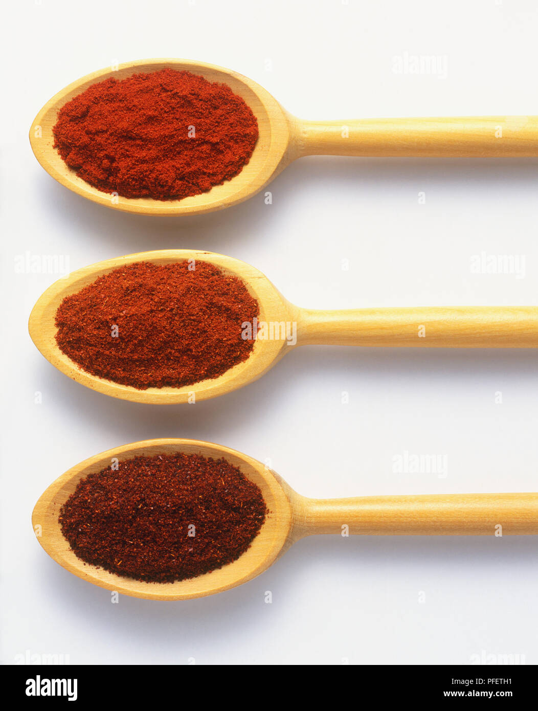 Types of powdered pepper on three wooden spoon Stock Photo - Alamy
