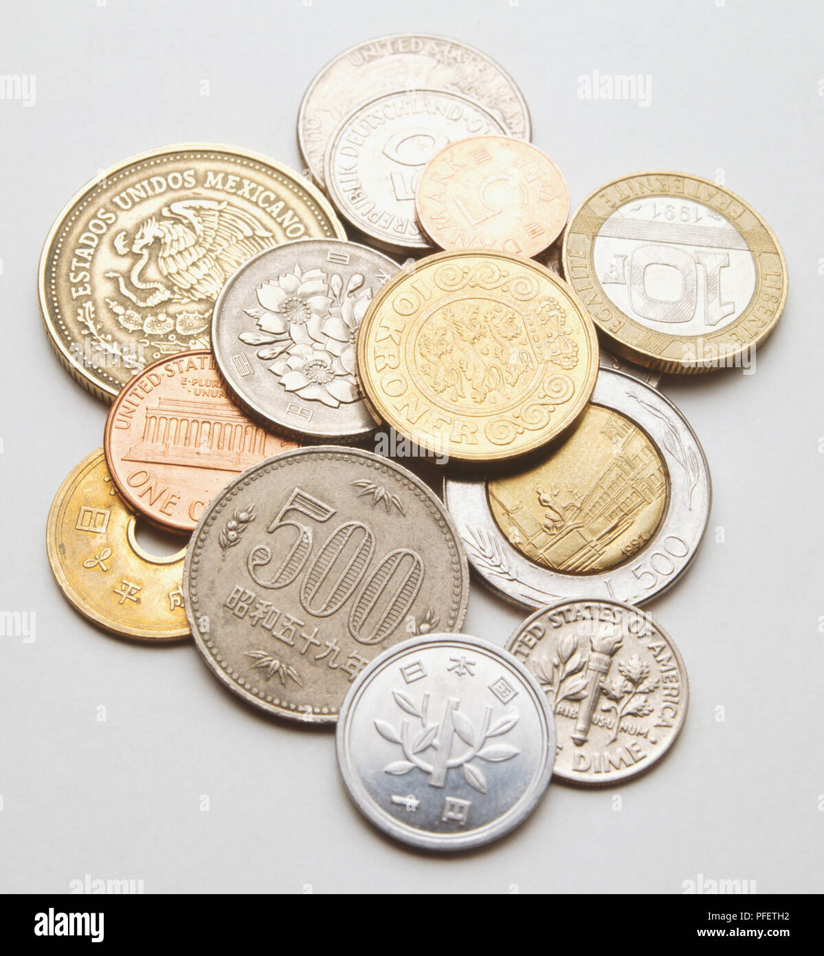 Different currency coins, view from above Stock Photo - Alamy
