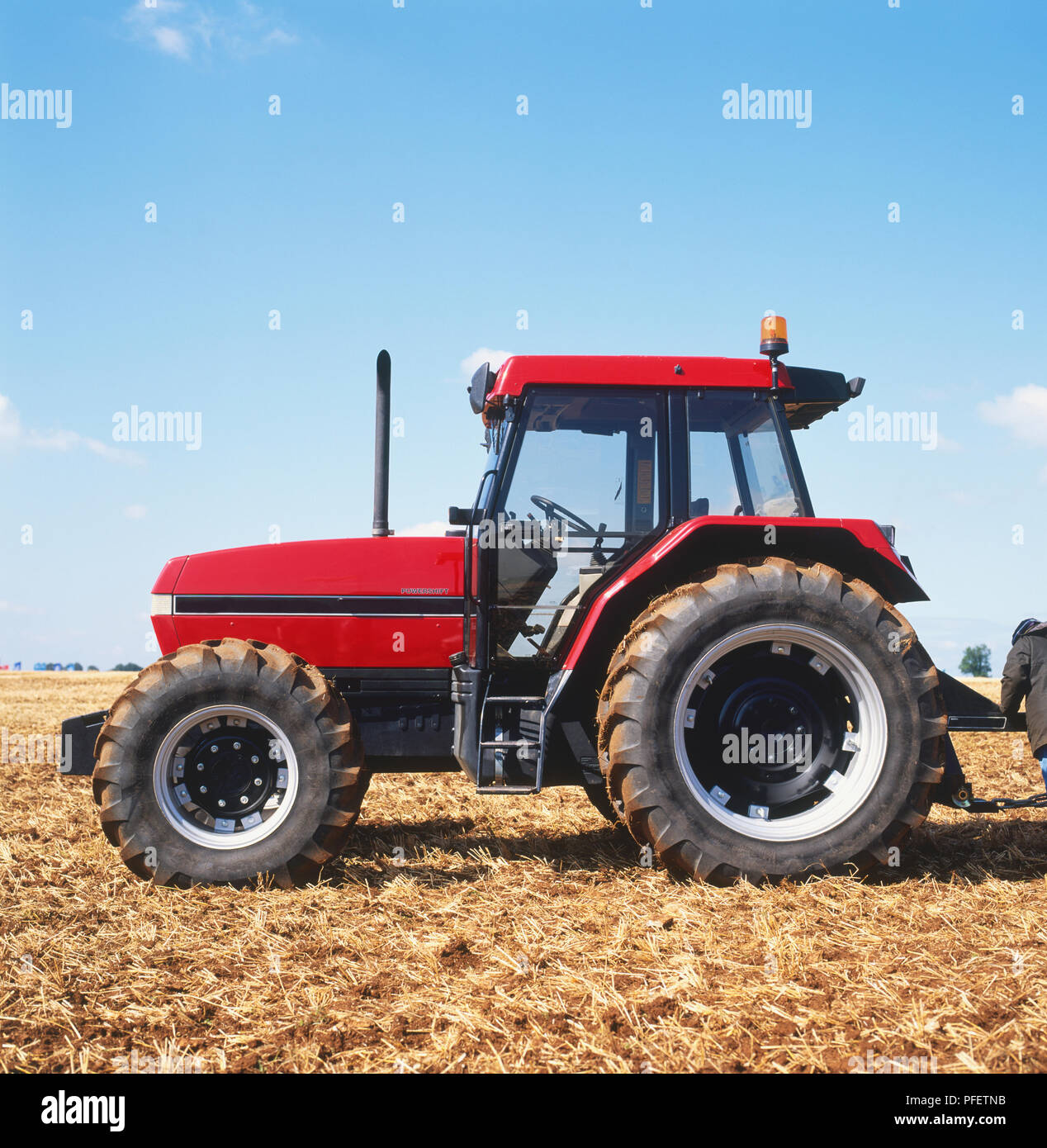A red tractor Stock Photo - Alamy