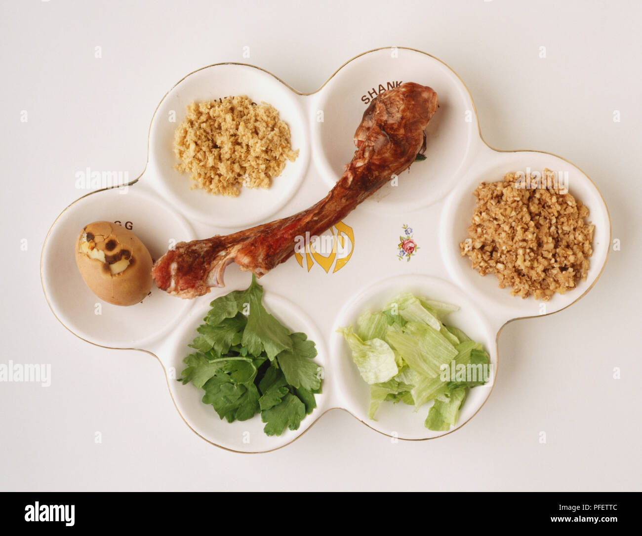 Plate that holds six foods for Jewish Passover Stock Photo - Alamy
