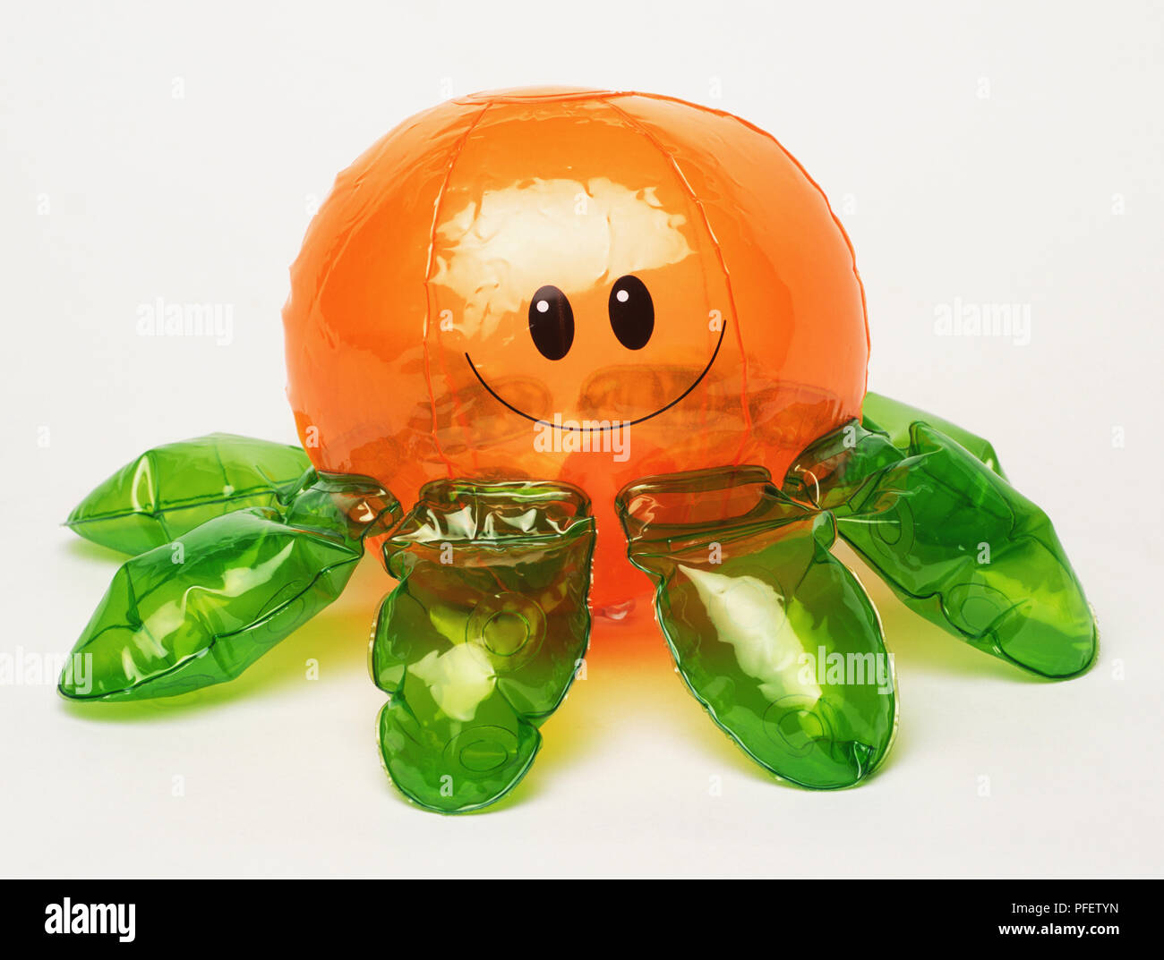 Blow-up orange and green Octopus Stock Photo - Alamy