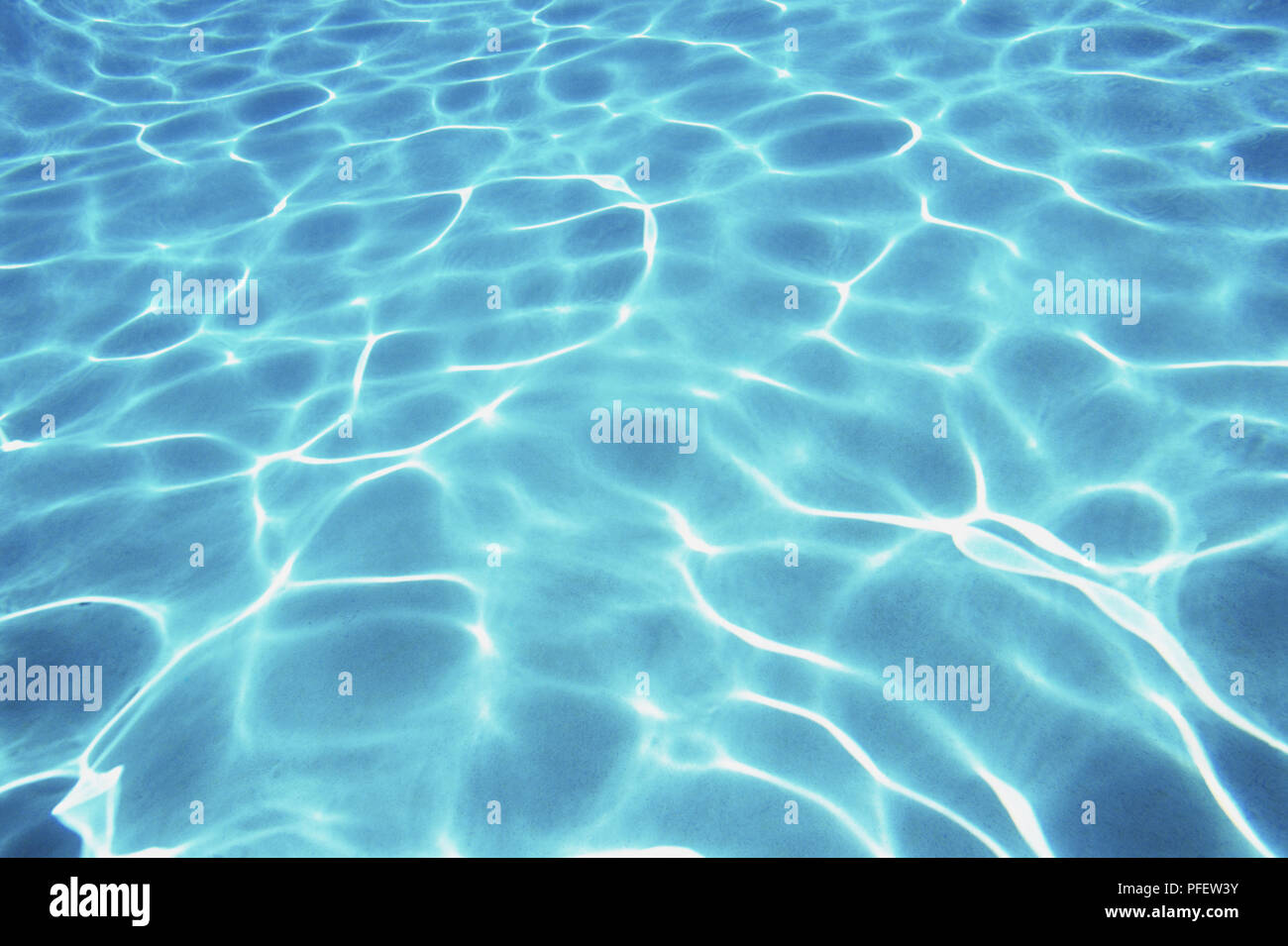 Sunlight on water in a swimming pool Stock Photo - Alamy