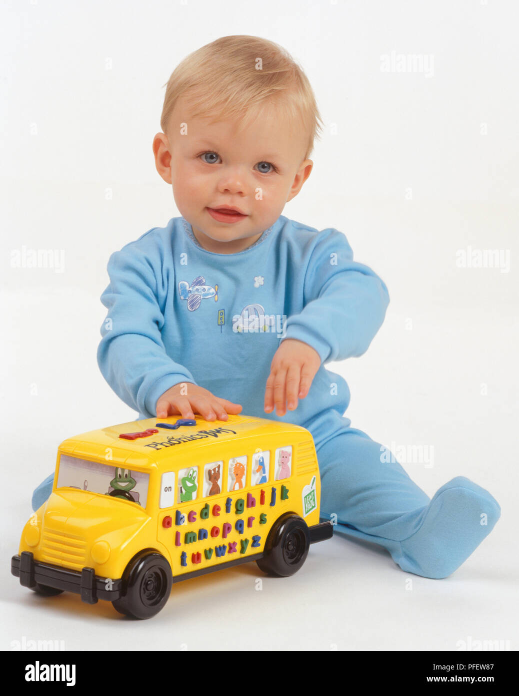 Boy playing with a toy bus hi-res stock photography and images - Alamy