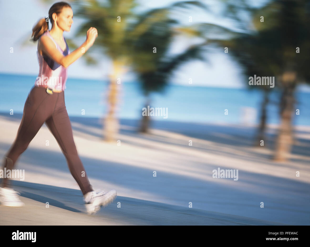 Woman side walking pavement exercise hi-res stock photography and ...