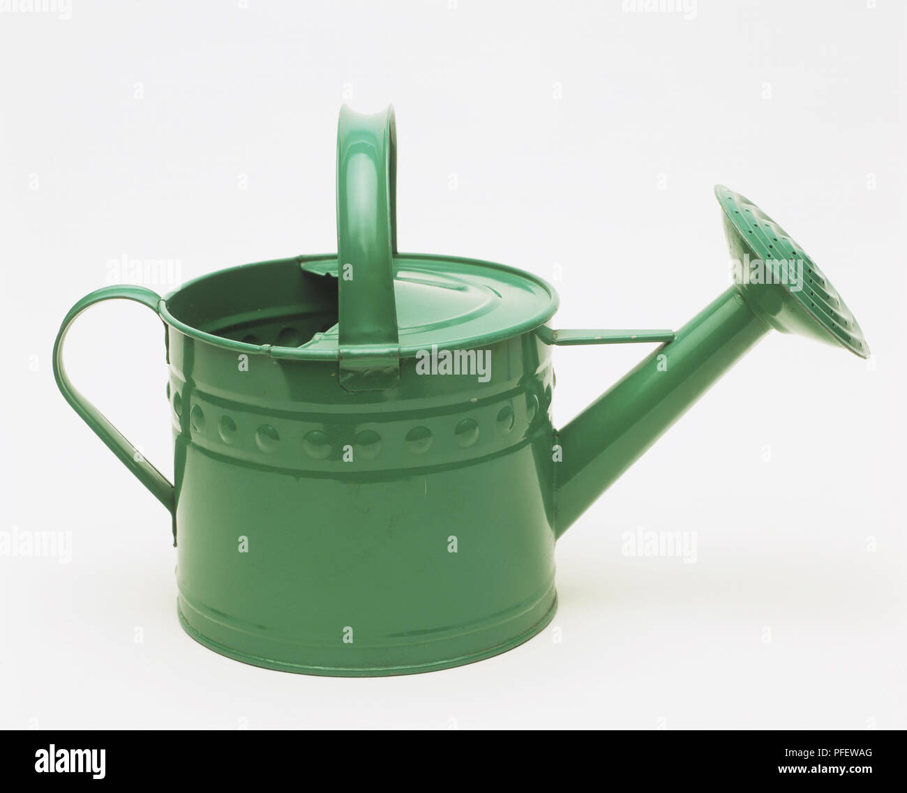 Green metal watering can, side view Stock Photo - Alamy