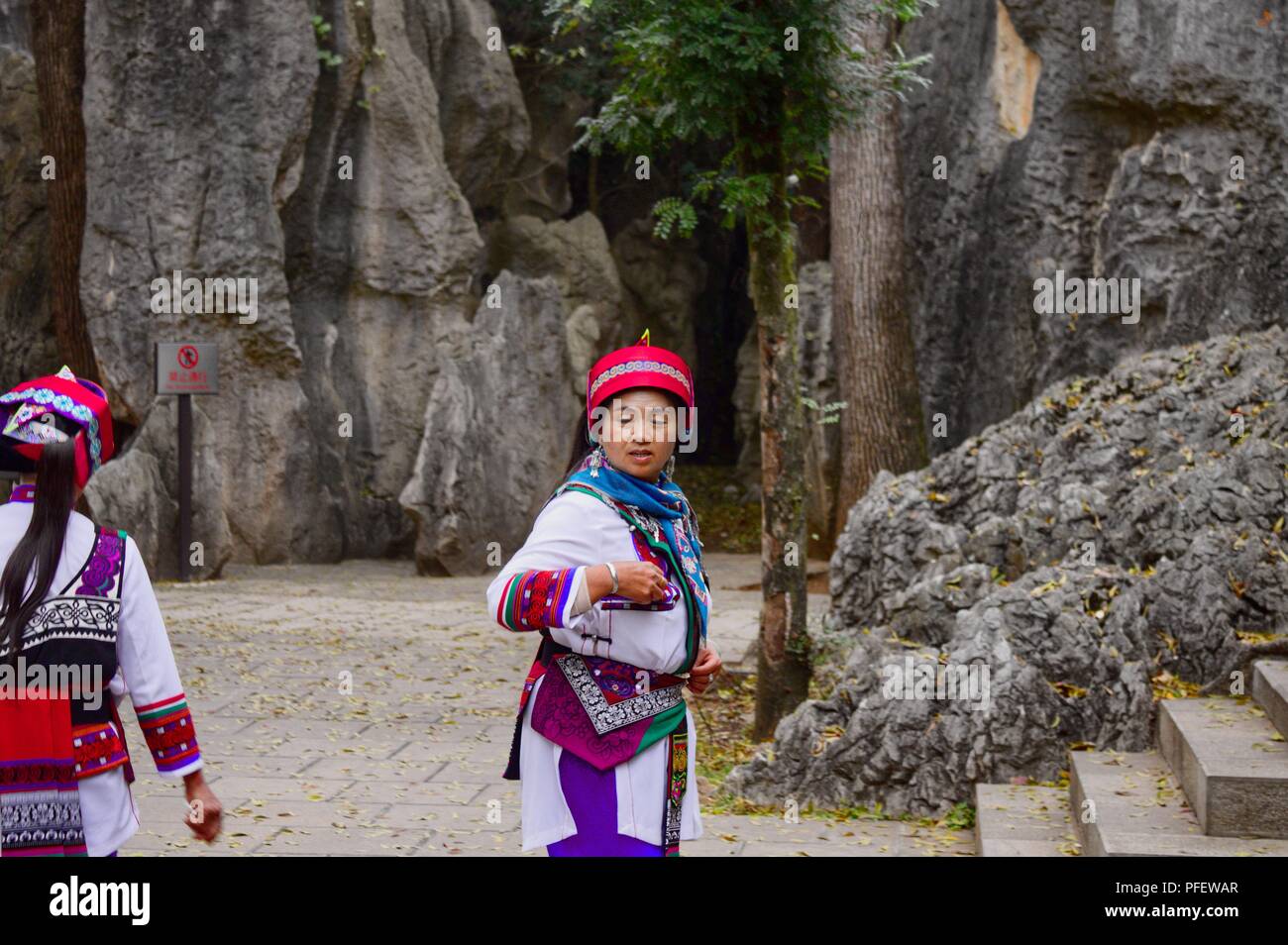 Shilin, Yunnan, China - 31 December 2017: A woman with traditional ...