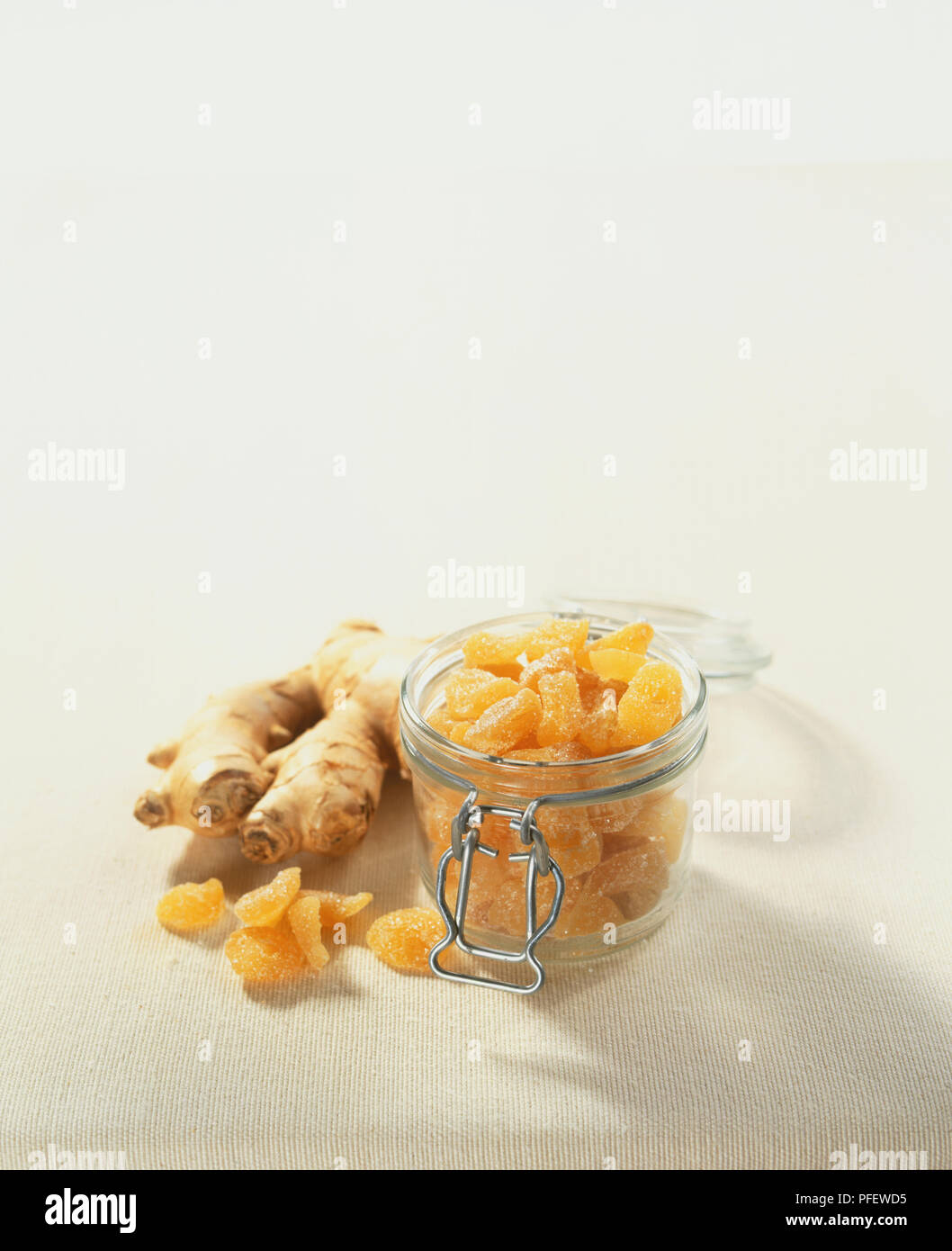 Ginger root and candied ginger in a glass jar Stock Photo - Alamy
