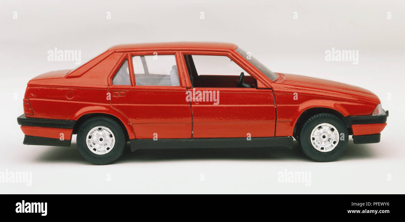 Model of red saloon car, side view Stock Photo - Alamy