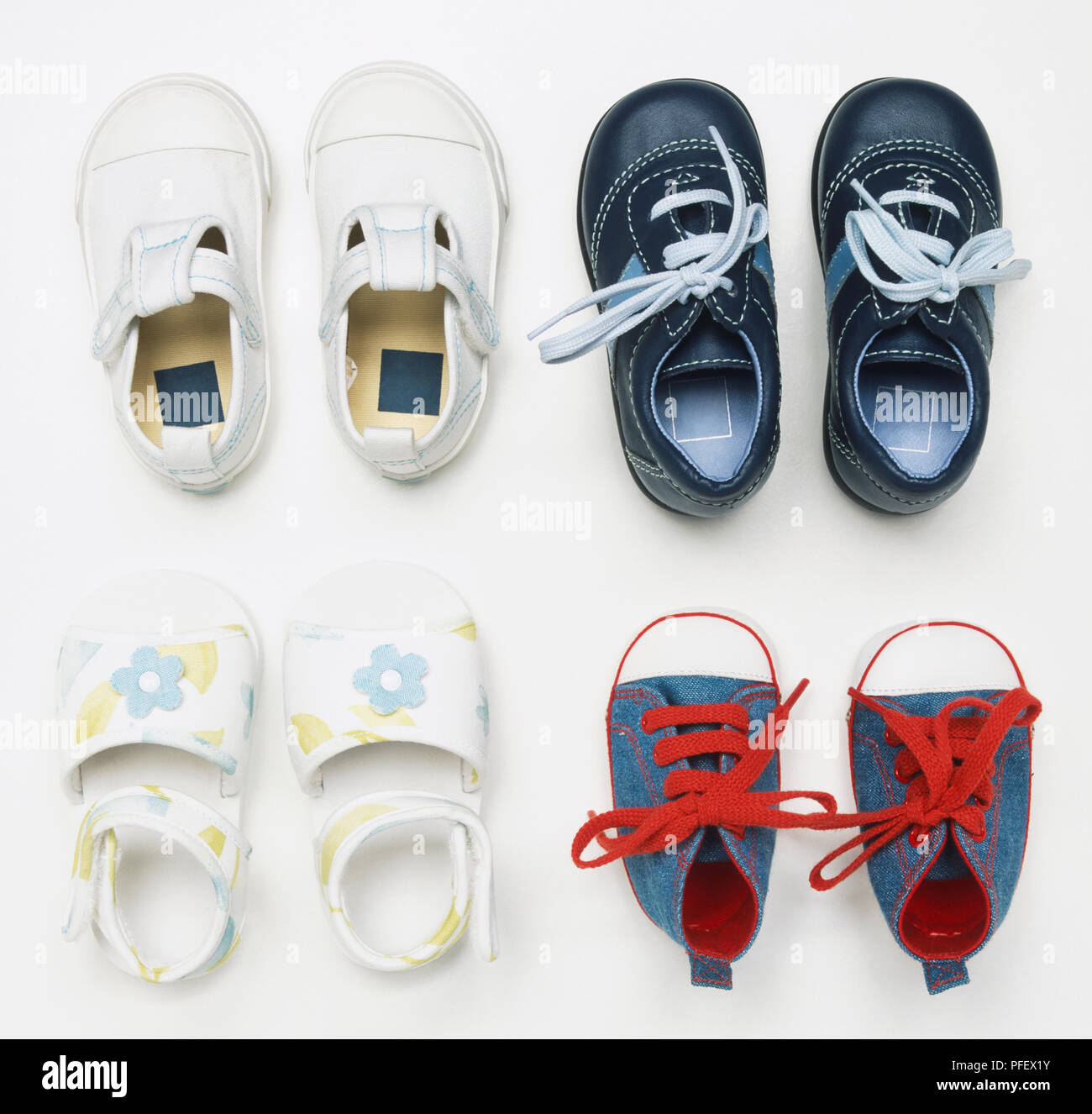 Four pairs of children's shoes, view from above Stock Photo - Alamy