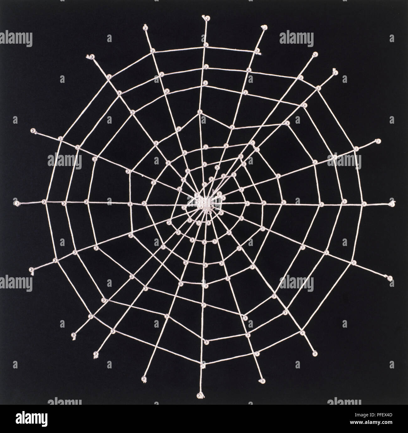 Spider's web made of string Stock Photo - Alamy