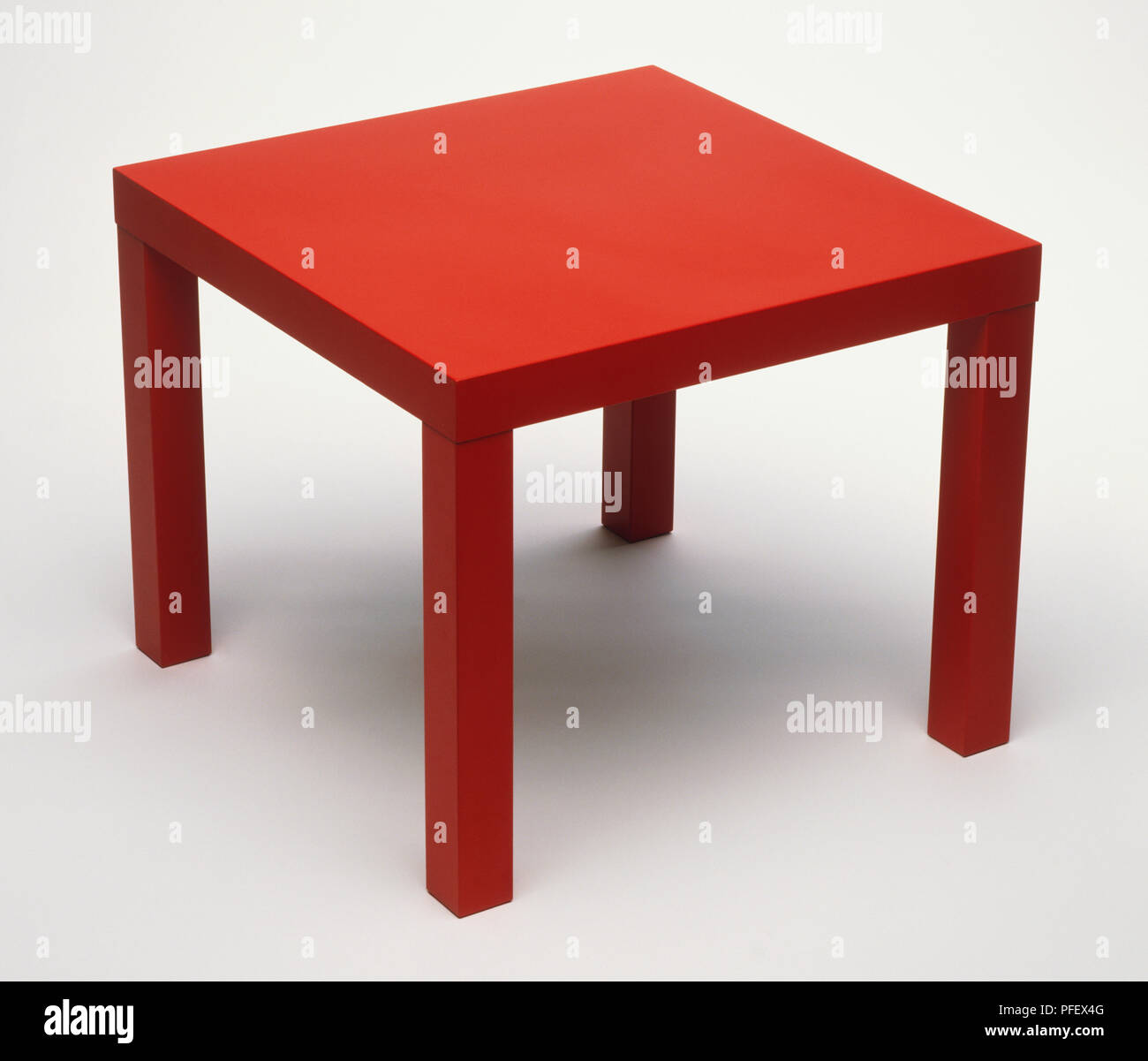 Red square table, view down two sides Stock Photo - Alamy