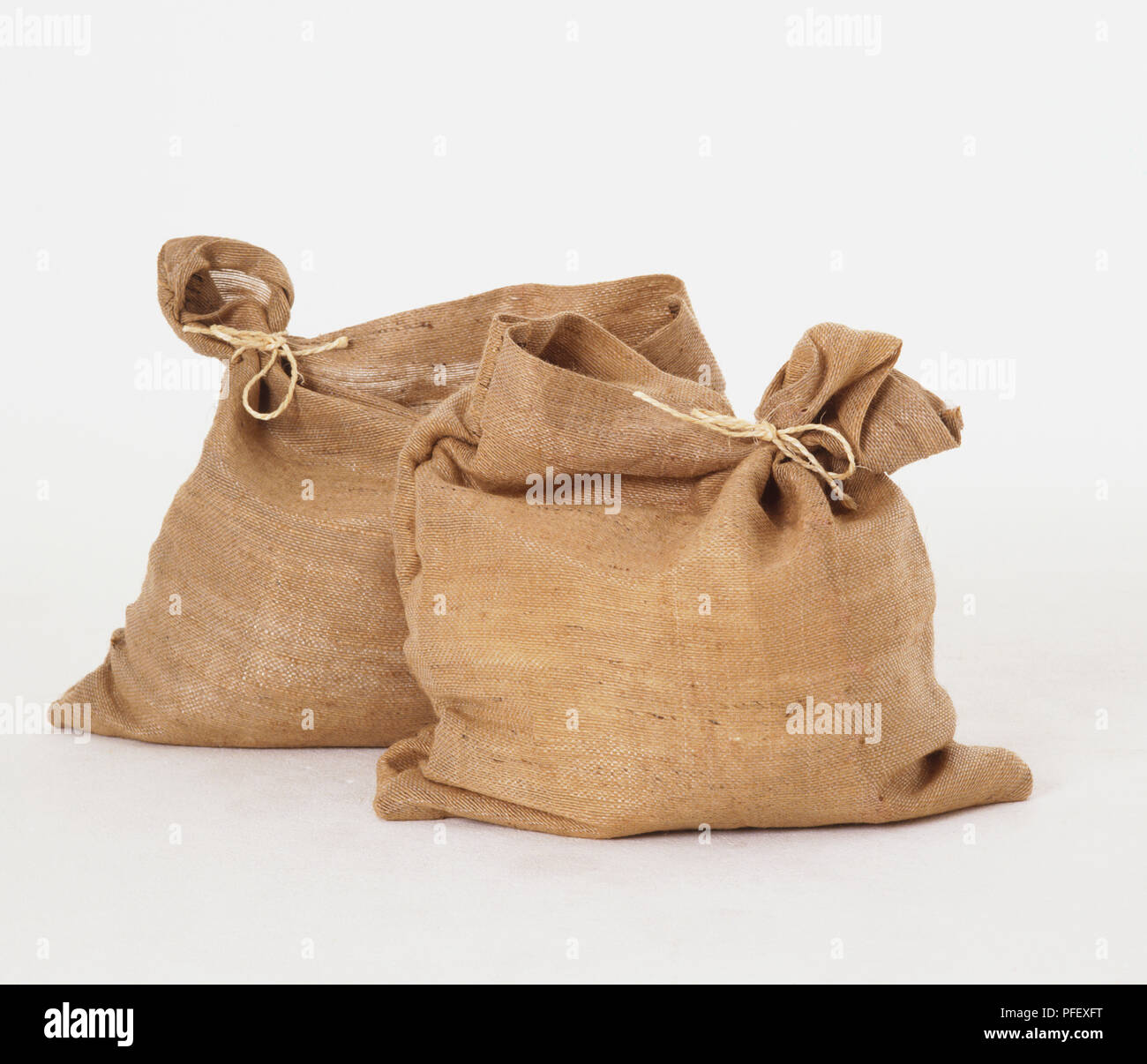 Brown sack tied string studio hi-res stock photography and images - Alamy
