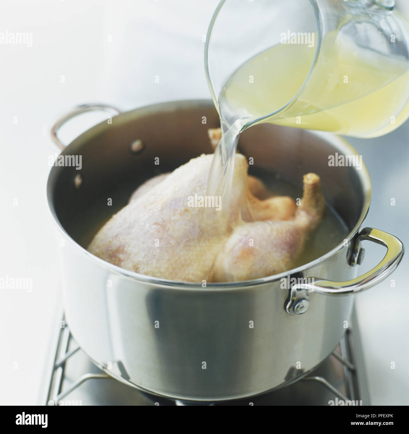 Pouring broth in pot hi-res stock photography and images - Alamy