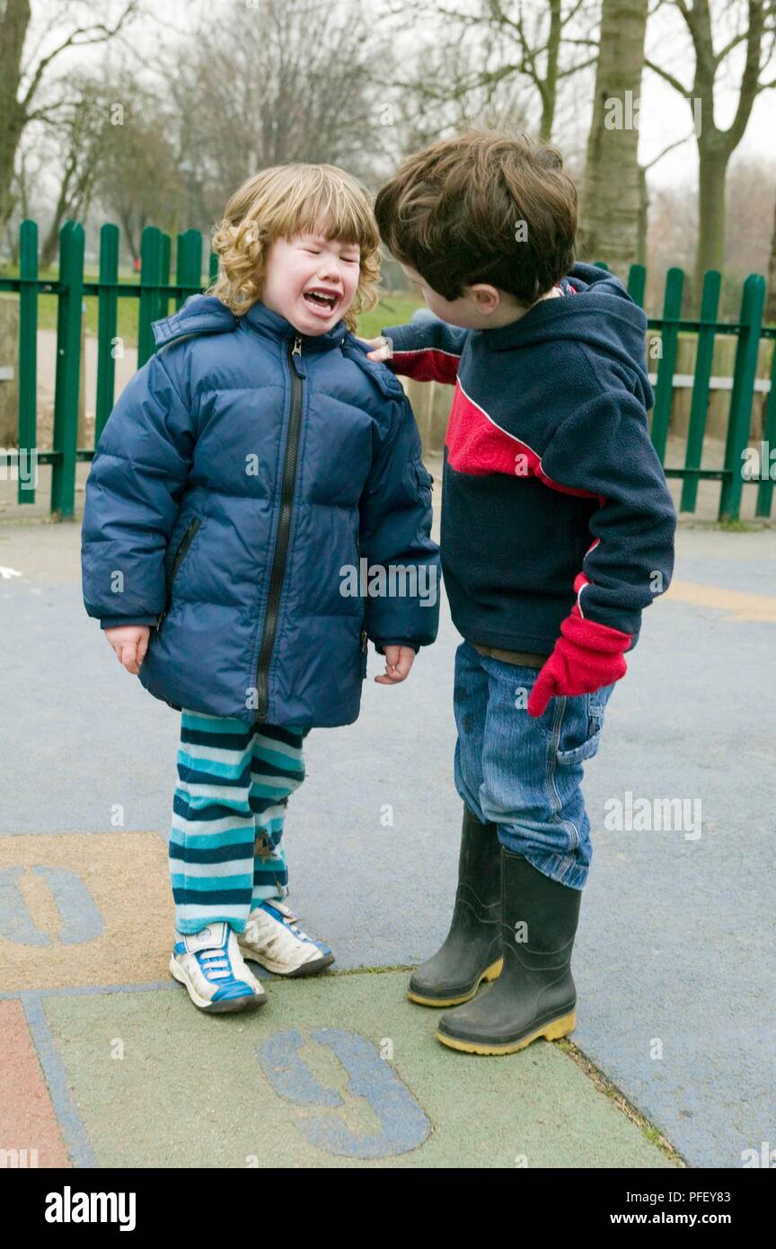 Boy crying in playground hi-res stock photography and images - Alamy