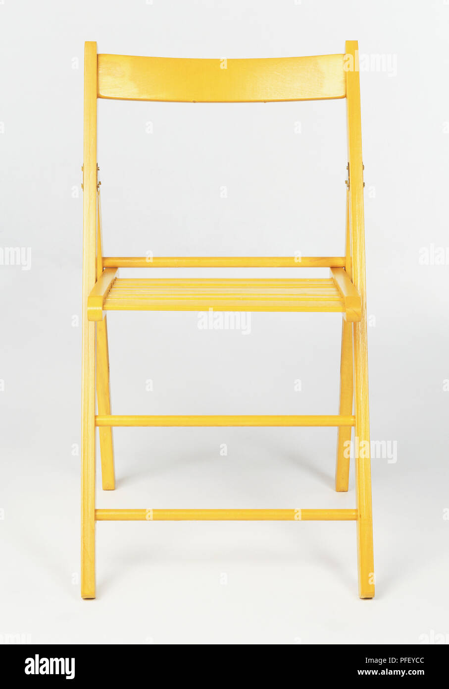 Yellow wooden chair, front view Stock Photo - Alamy