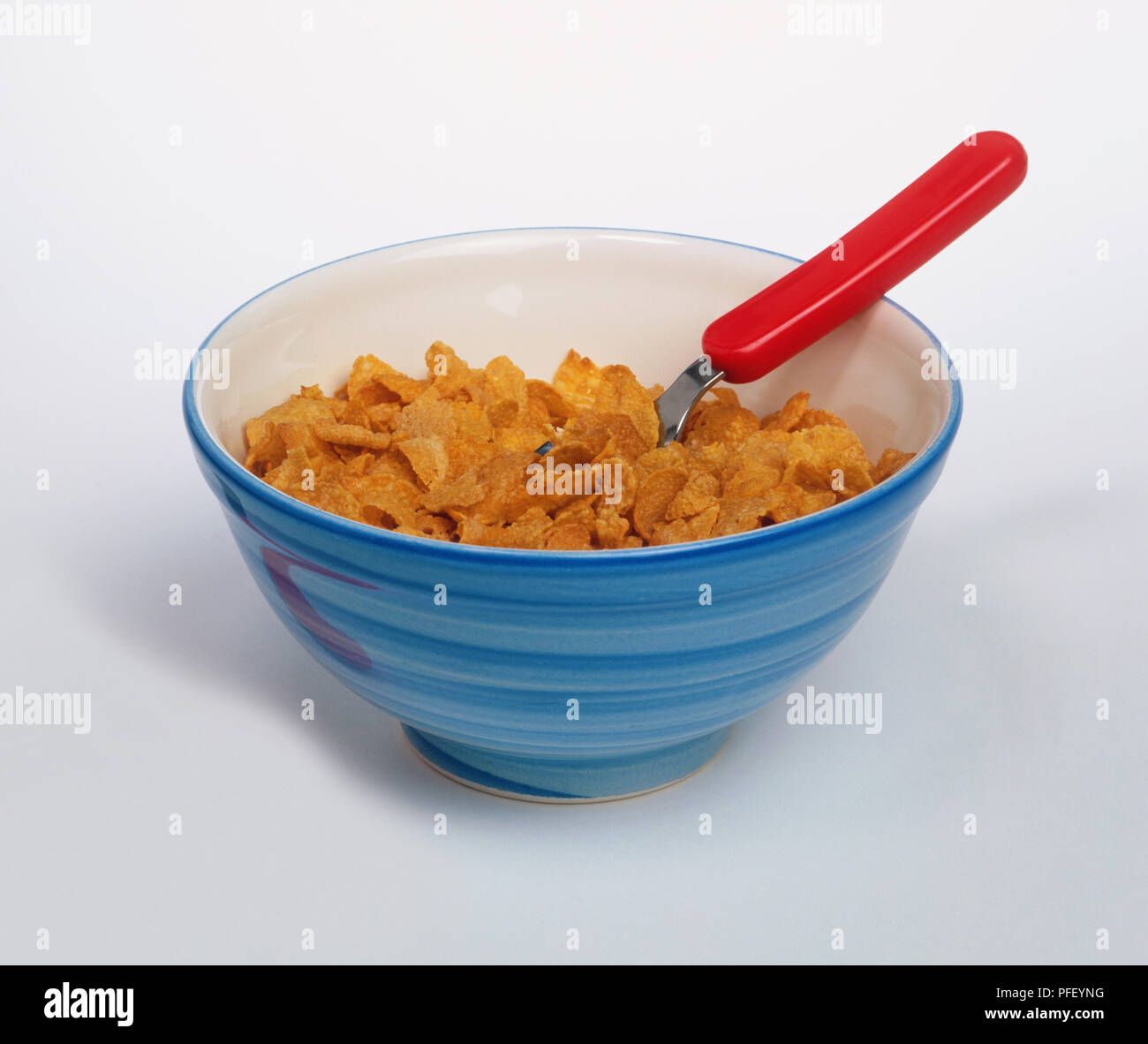 Bowl of breakfast cereals with spoon embedded Stock Photo - Alamy