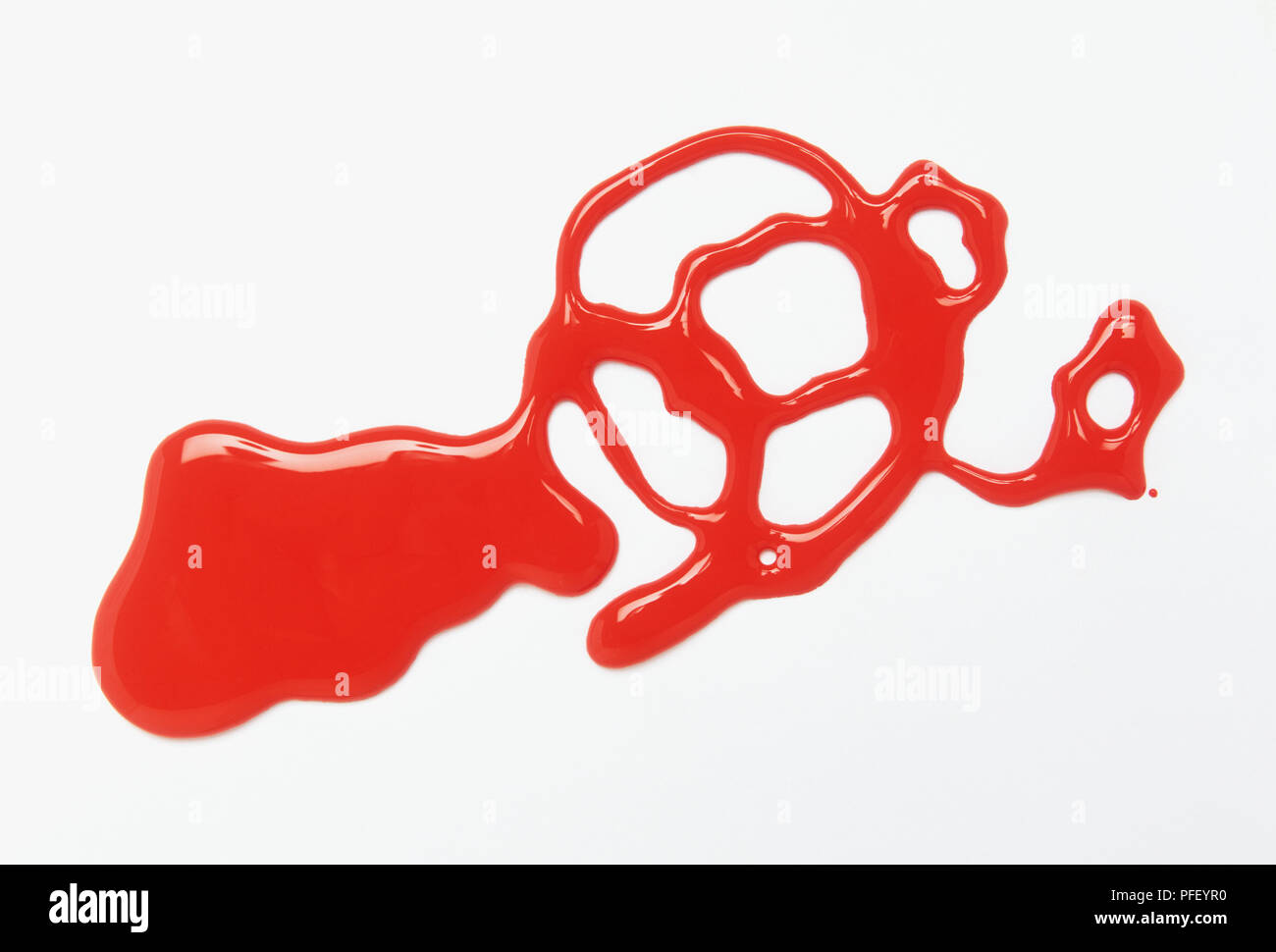 Red blob of paint forming a rounded pattern Stock Photo - Alamy