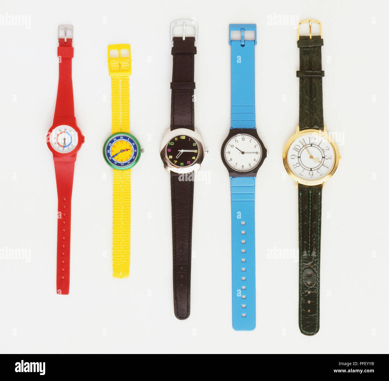 Five different coloured wristwatches, red, yellow, black and blue Stock ...