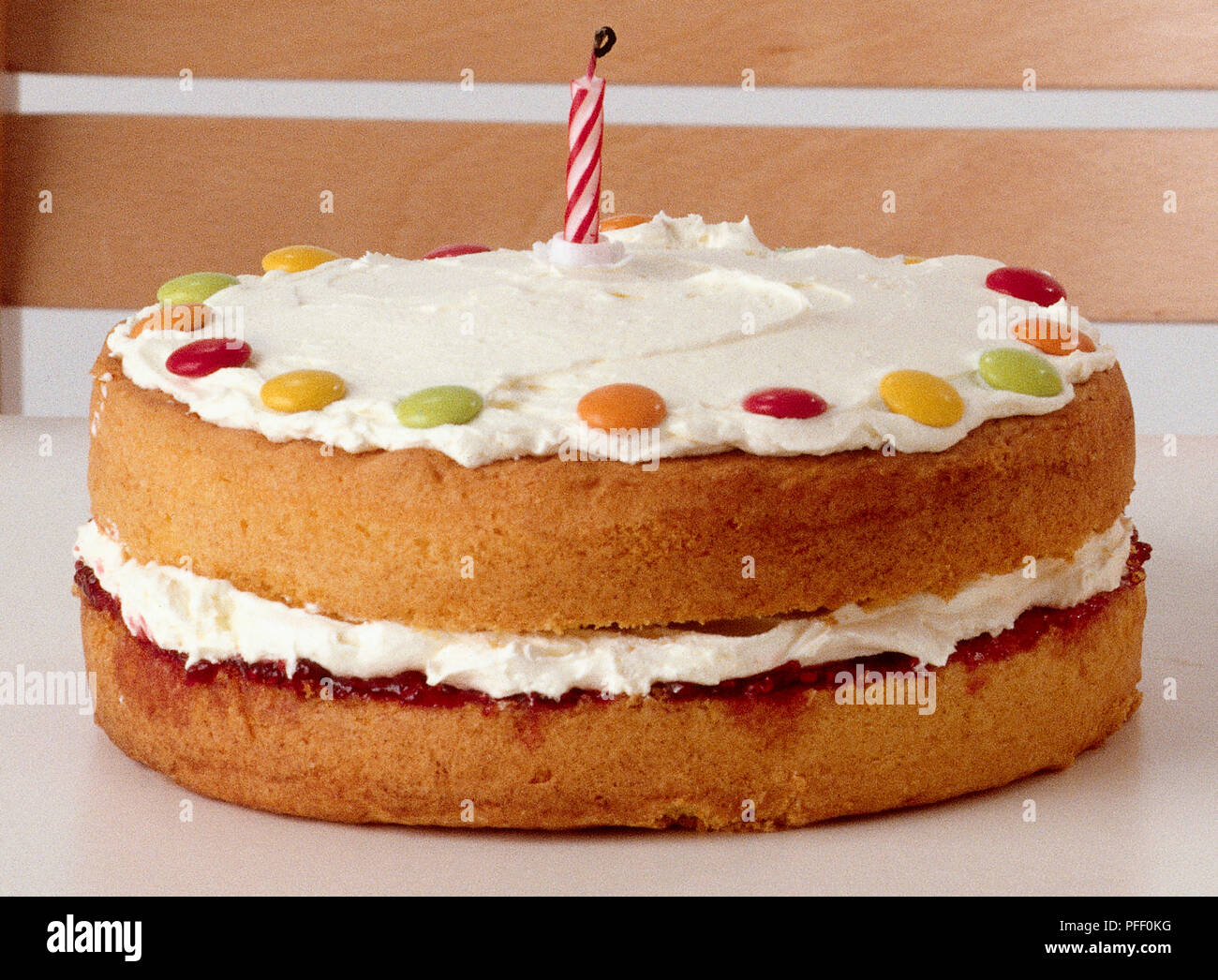 Birthday Cake with One Candle Stock Photo - Alamy