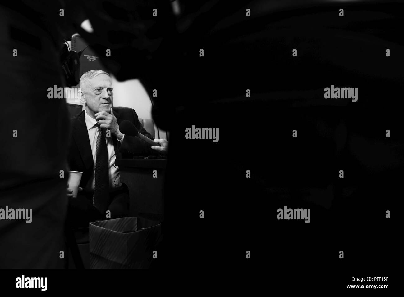 Secretary of Defense James N. Mattis speaks with reporters while on ...