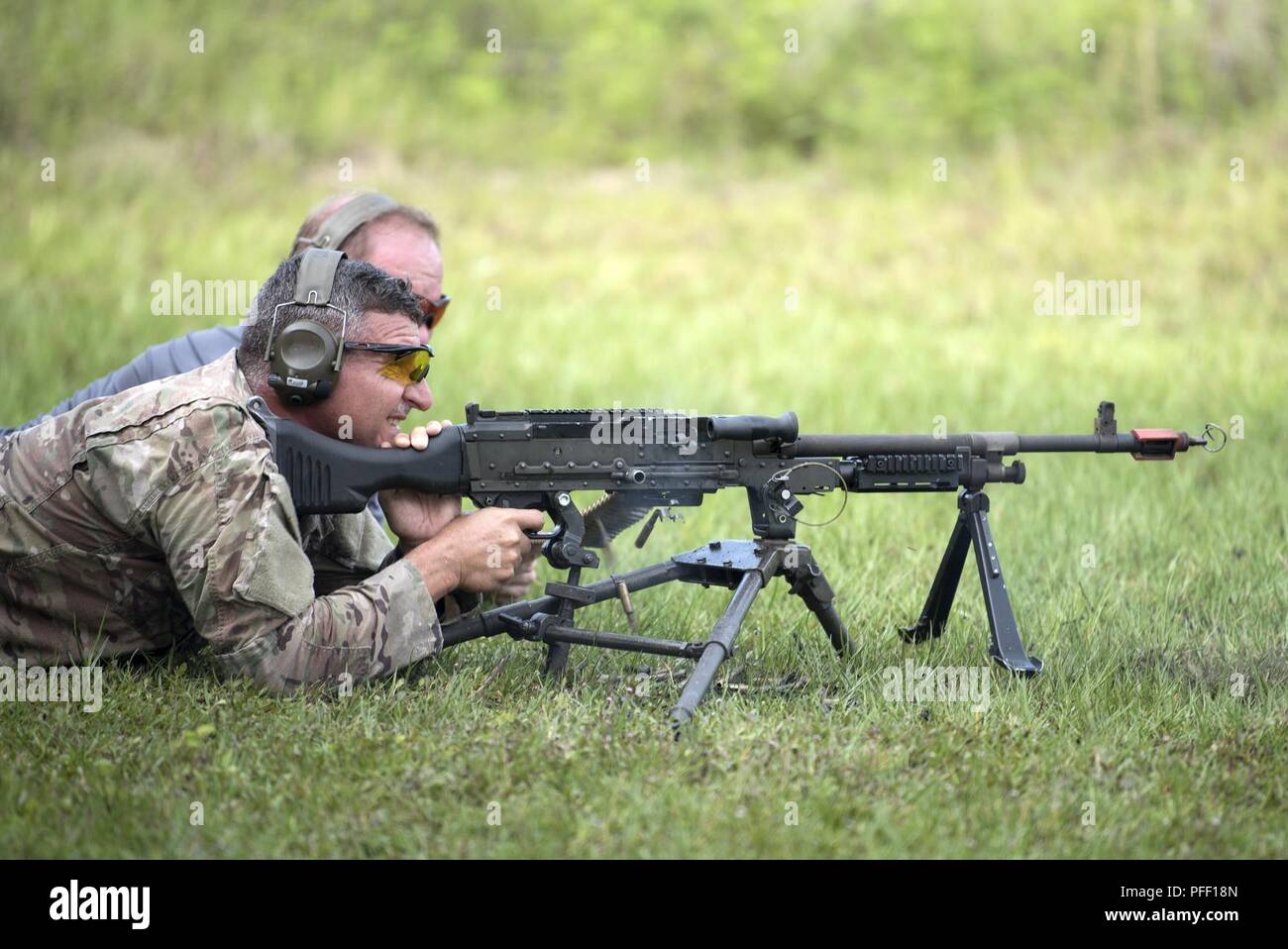 Participants fire blanks on an M240B machine gun during a U.S. Special ...