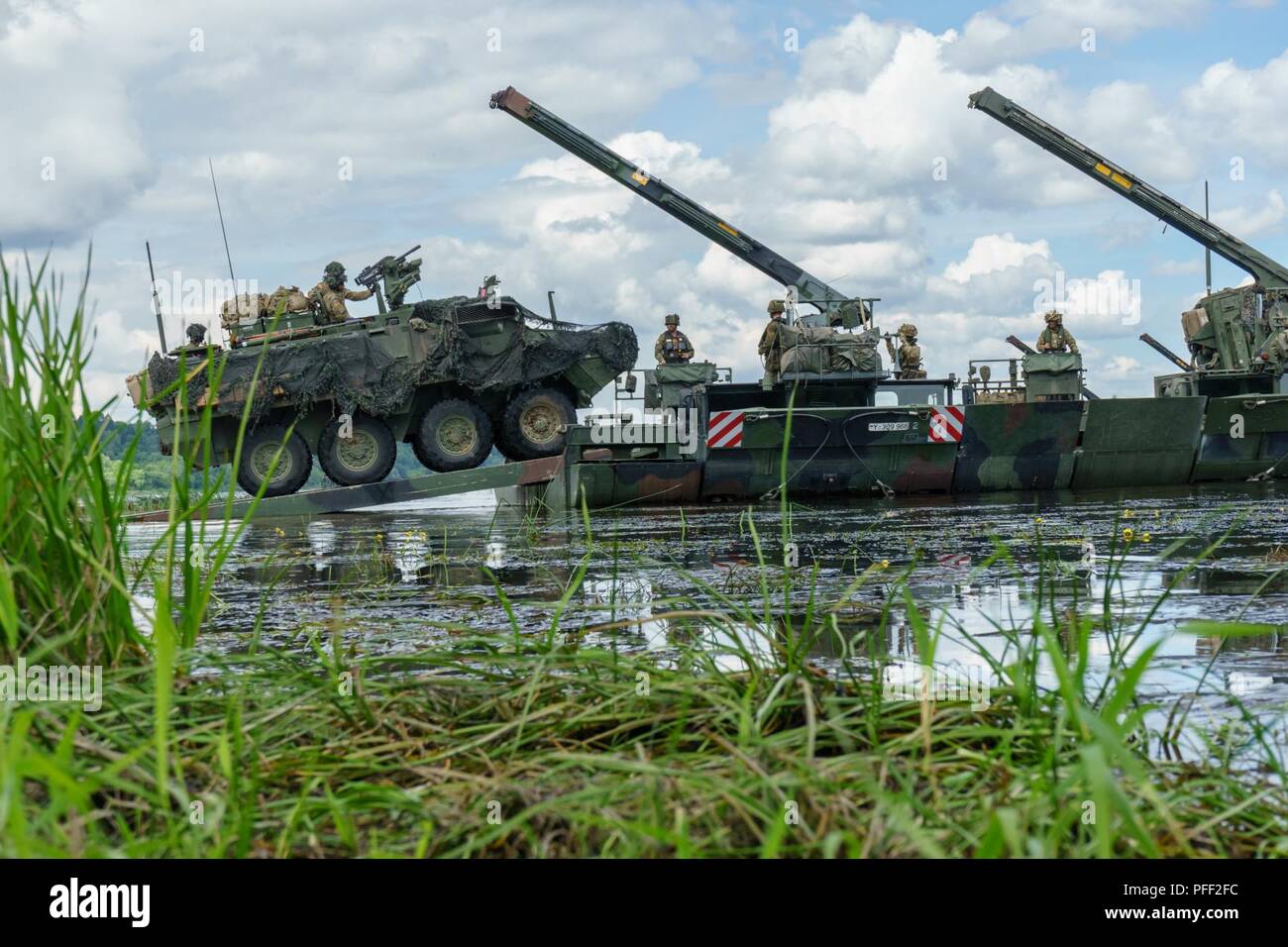 A 2d Cavalry Regiment Stryker combat vehicle boards a German M3 ...