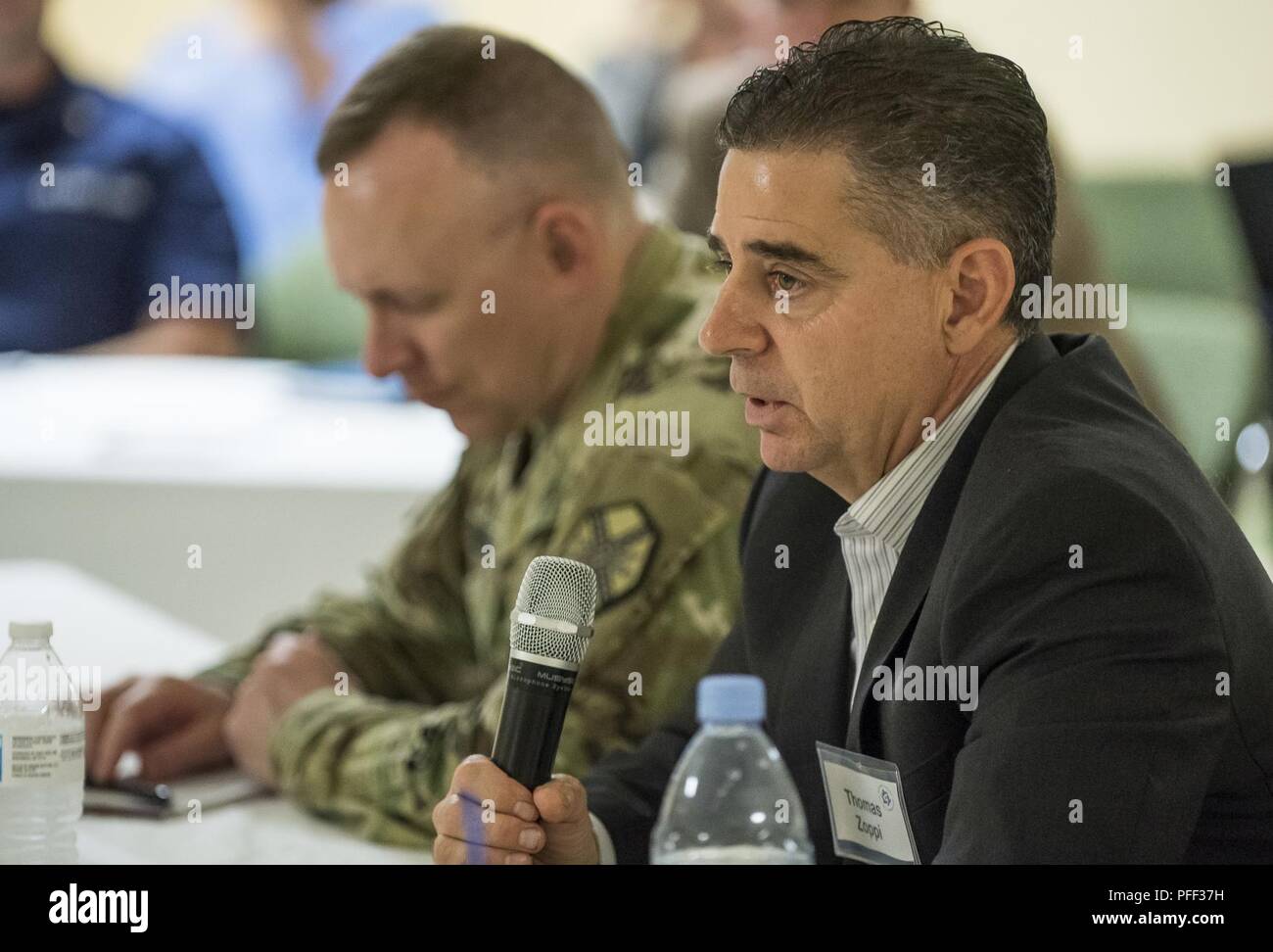 Thomas Zoppi, a military spouse talks with fellow spouses, military ...