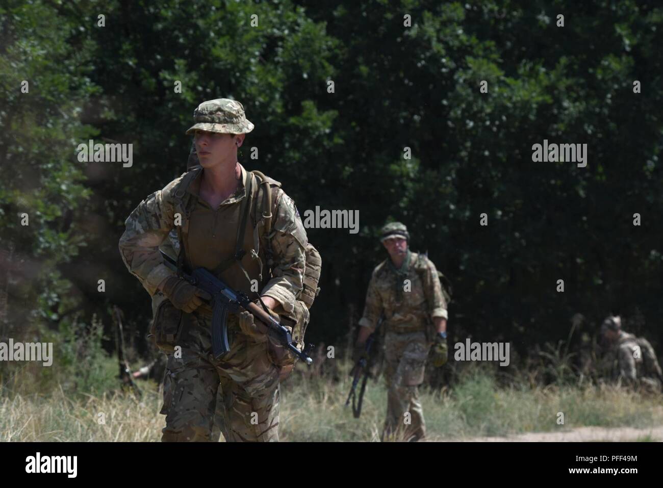 Soldiers assigned to the British army defend the perimeter during foot ...