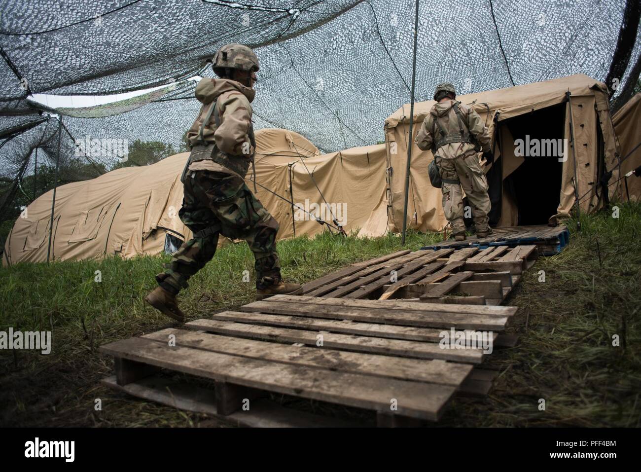 Soldiers assigned to the 45th Field Artillery Brigade (FAB) navigate ...
