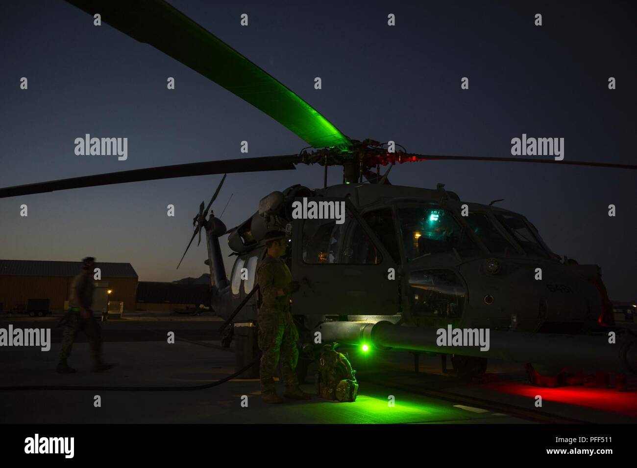 A crew prepares an HH-60G Pave Hawk helicopter prior to a large-scale U ...