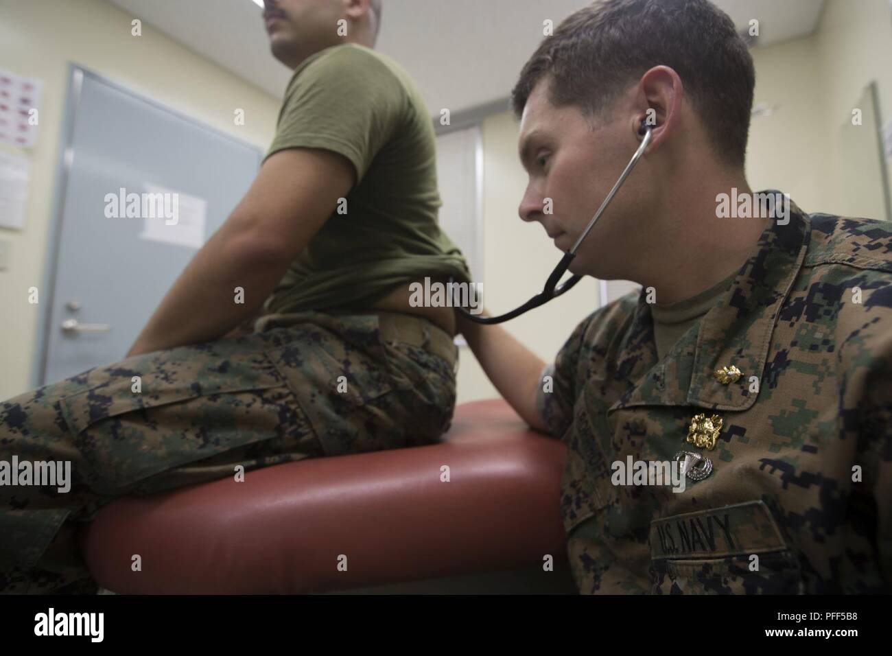 U.S. Navy Lt. Cmdr. Nick Rohrhoff, a diving medical officer with 3rd ...